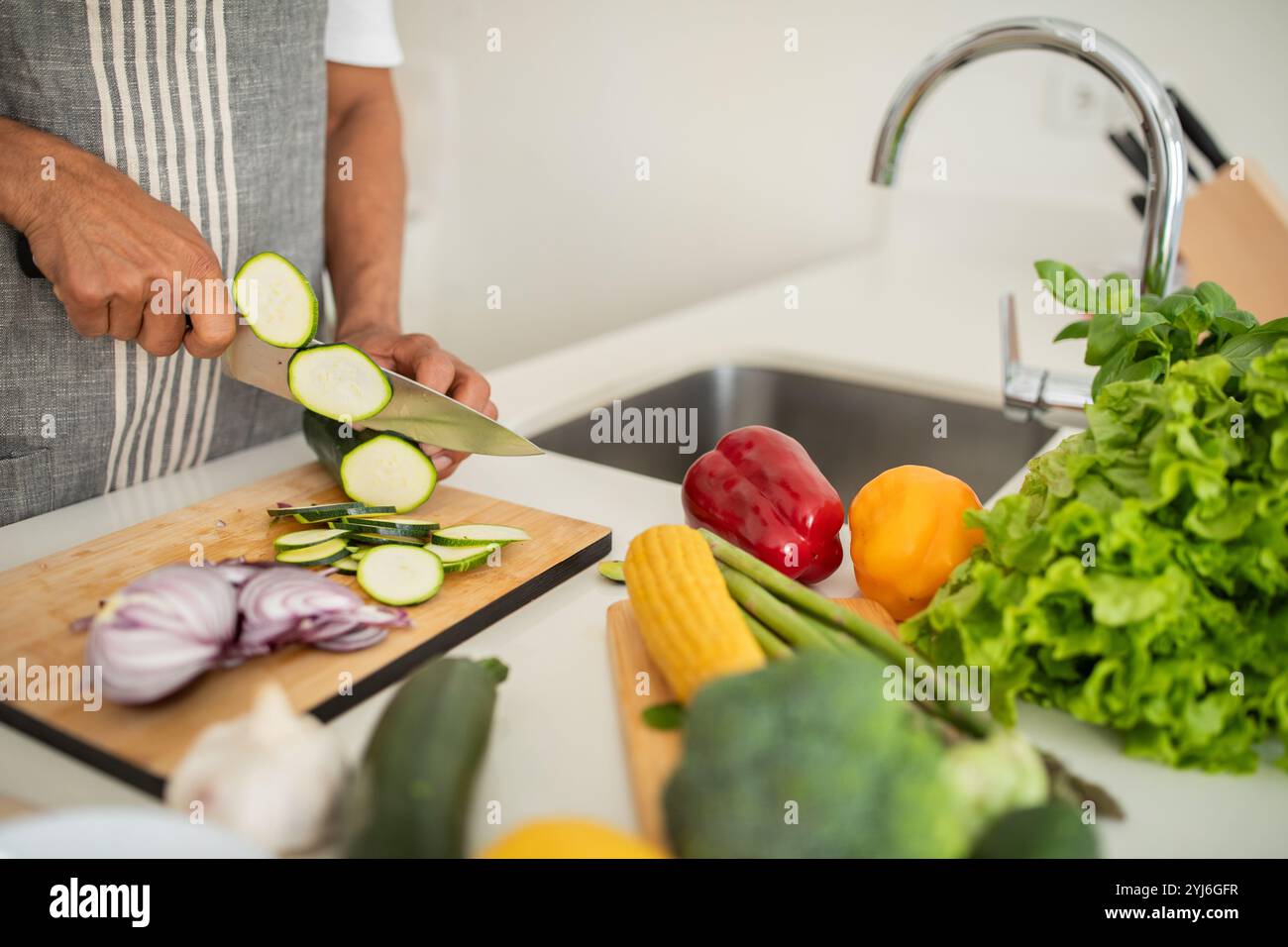 Person skillfully chops ingredients in hi-res stock photography and ...