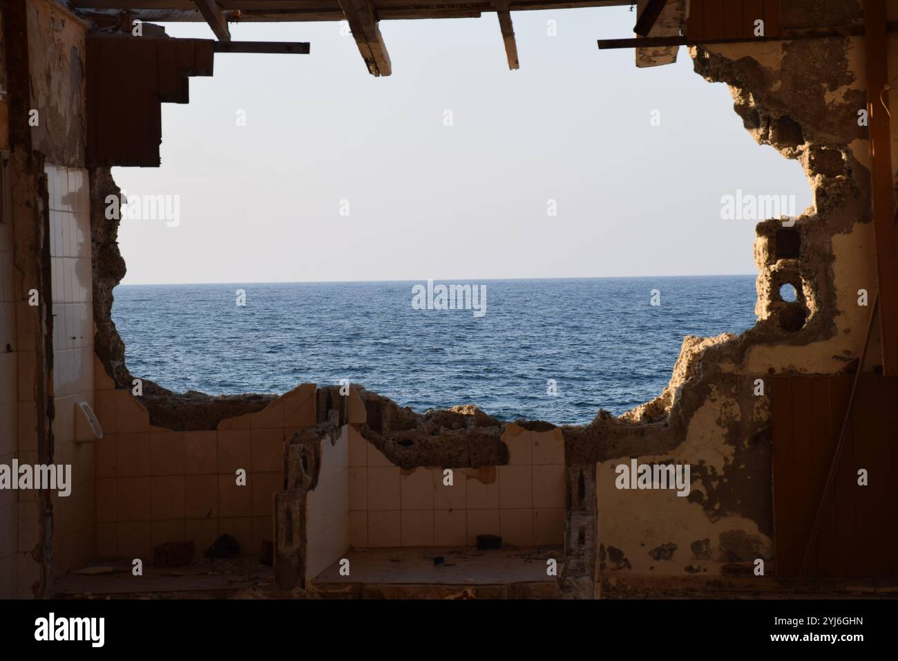 broken wall with sea background, old building , sea view from old ...