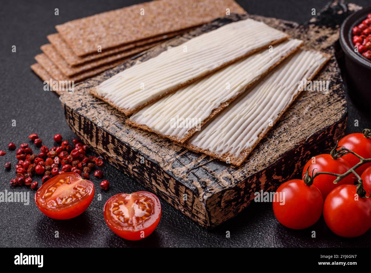 Rectangular whole grain crisp bread with cream cheese for a hearty ...