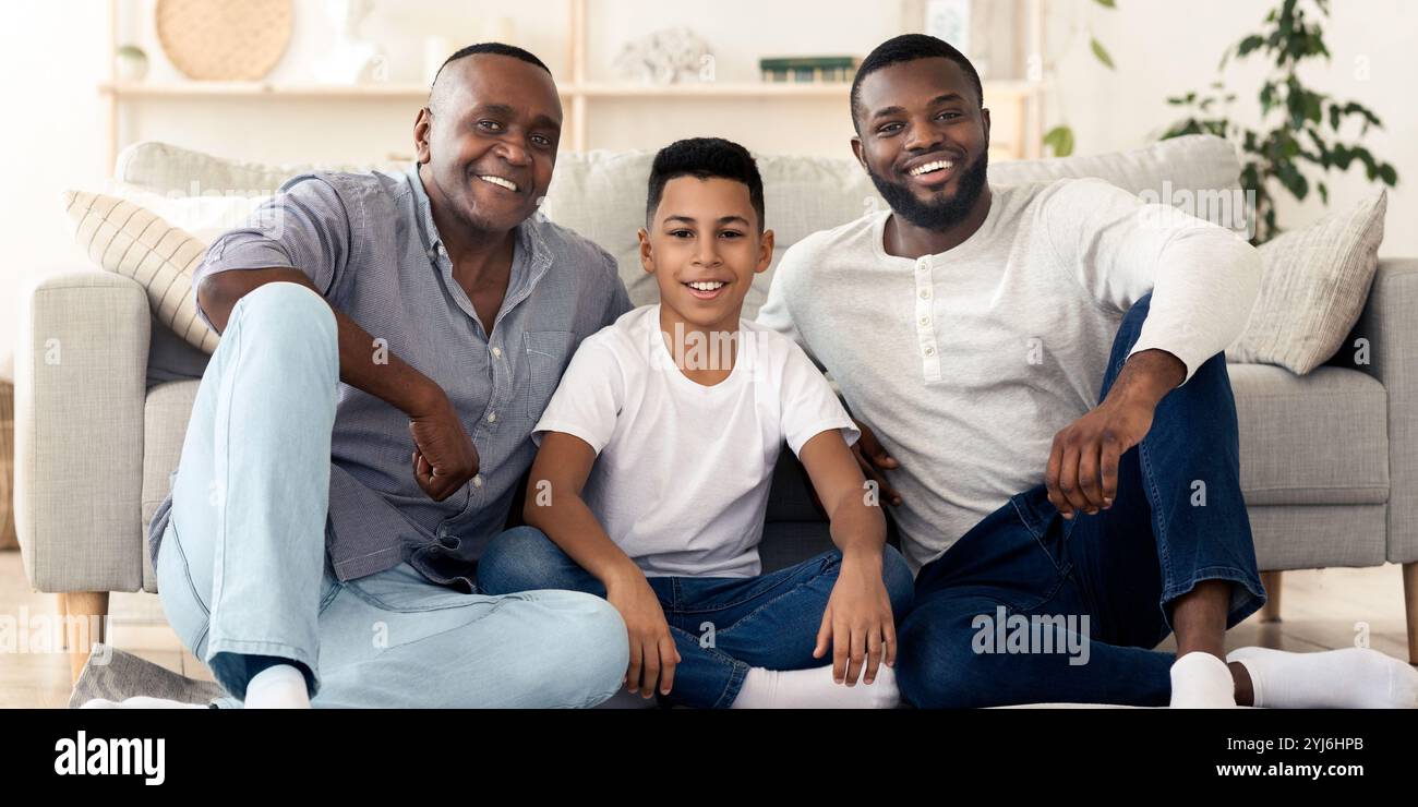 Three generation men family portrait. Happy little boy posing with his ...