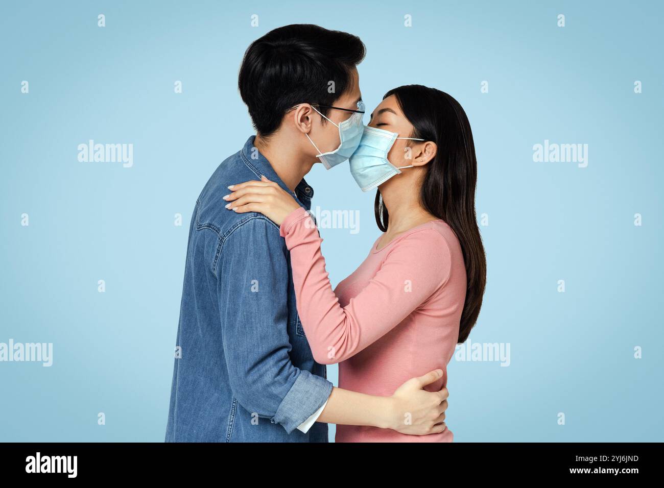 Quarantine Romance. Loving Asian Couple Kissing Each Other With ...