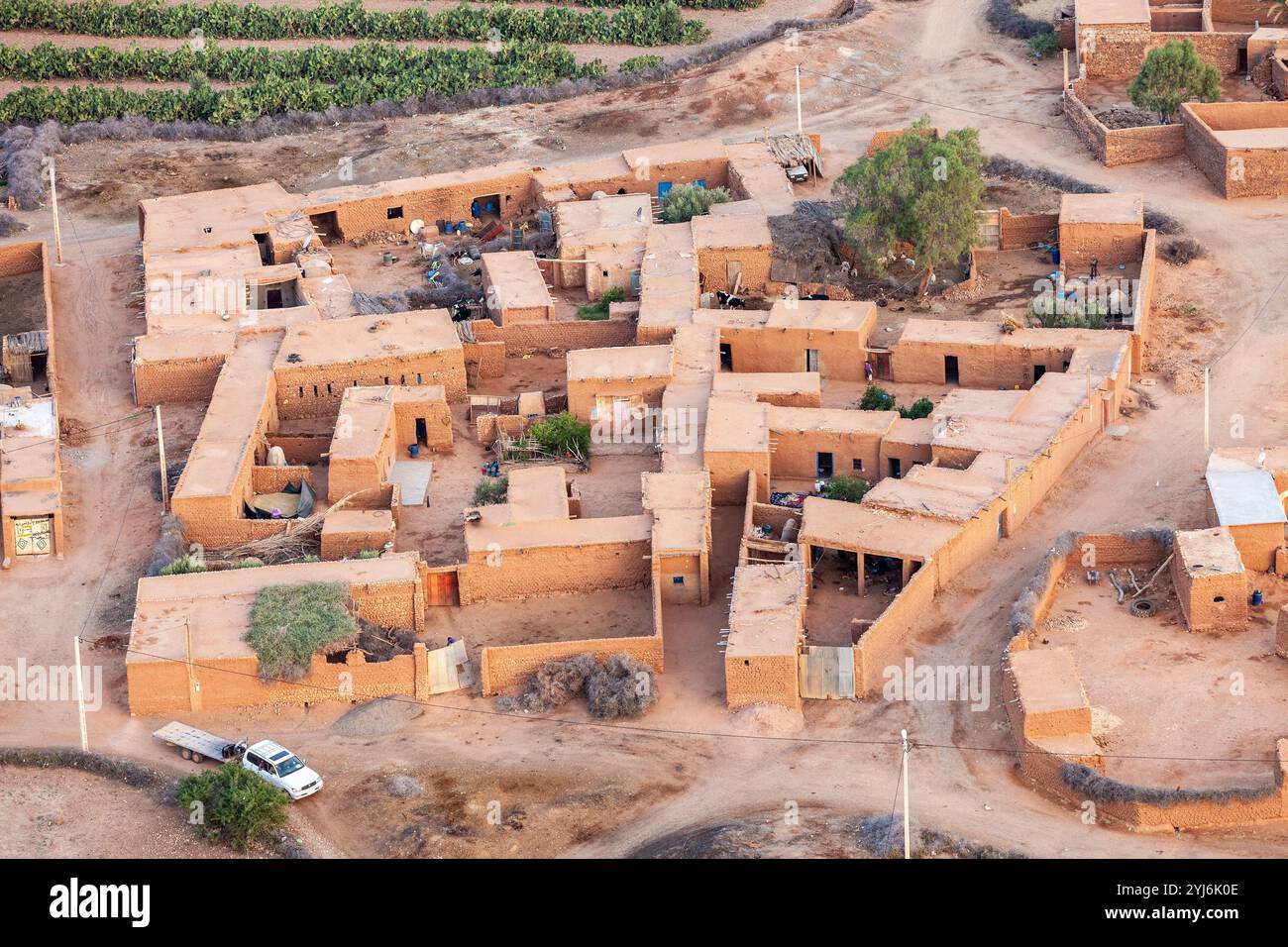 Aerial view of a traditional Moroccan village in a desert plain at the ...