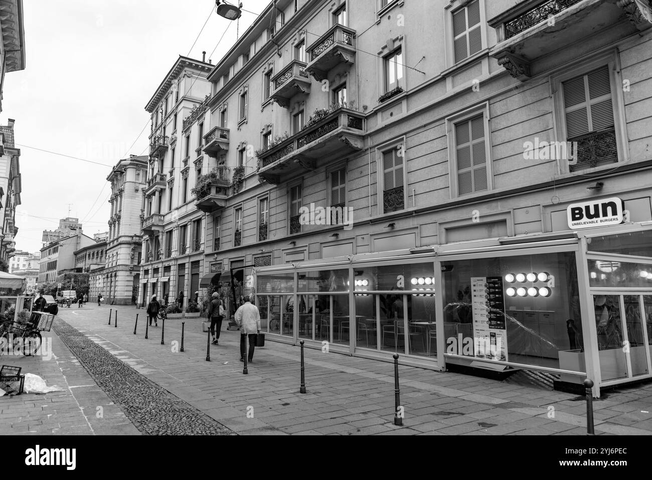 Milan, Italy - March 30: Typical Italian buildings and street view in ...