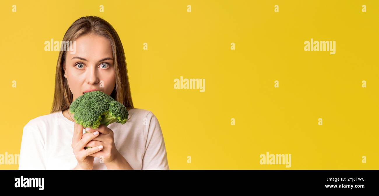 Young Woman Eating Broccoli, Biting Healthy Vegetable With Wide-Opened ...