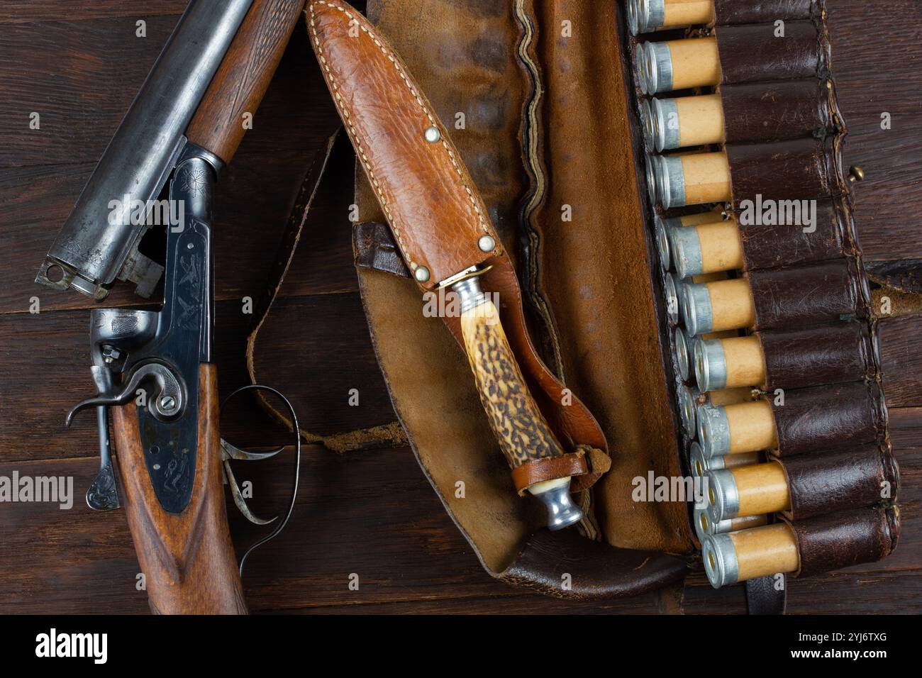hunting double barreled side shotgun with cartridges in bandolier on ...