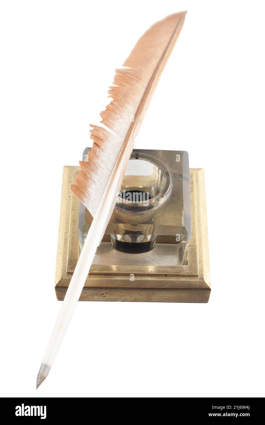 vintage feather quill with glass inkwell isolated on white background ...