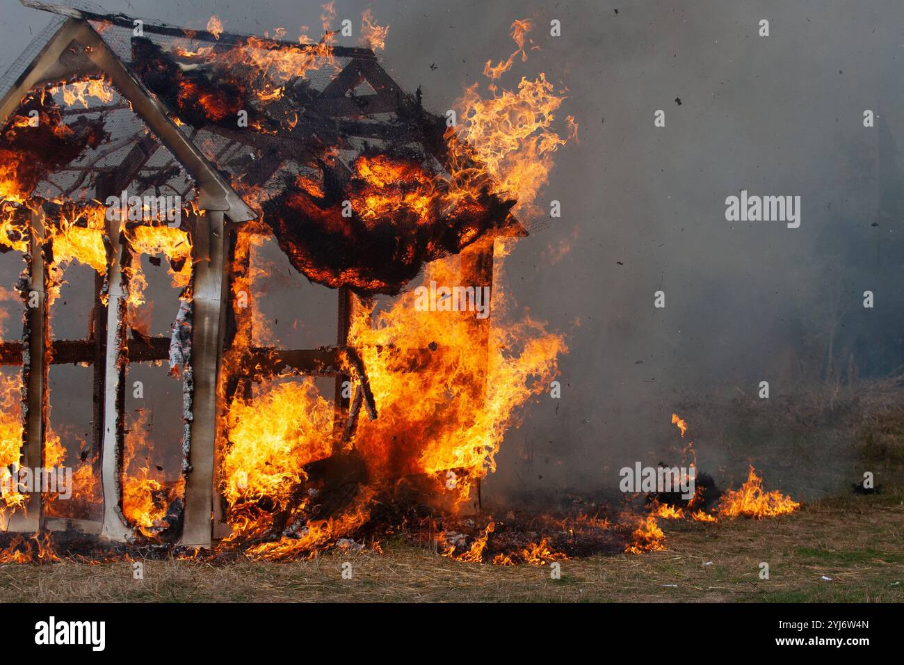 burning fire in a small wooden house in the village Stock Photo - Alamy