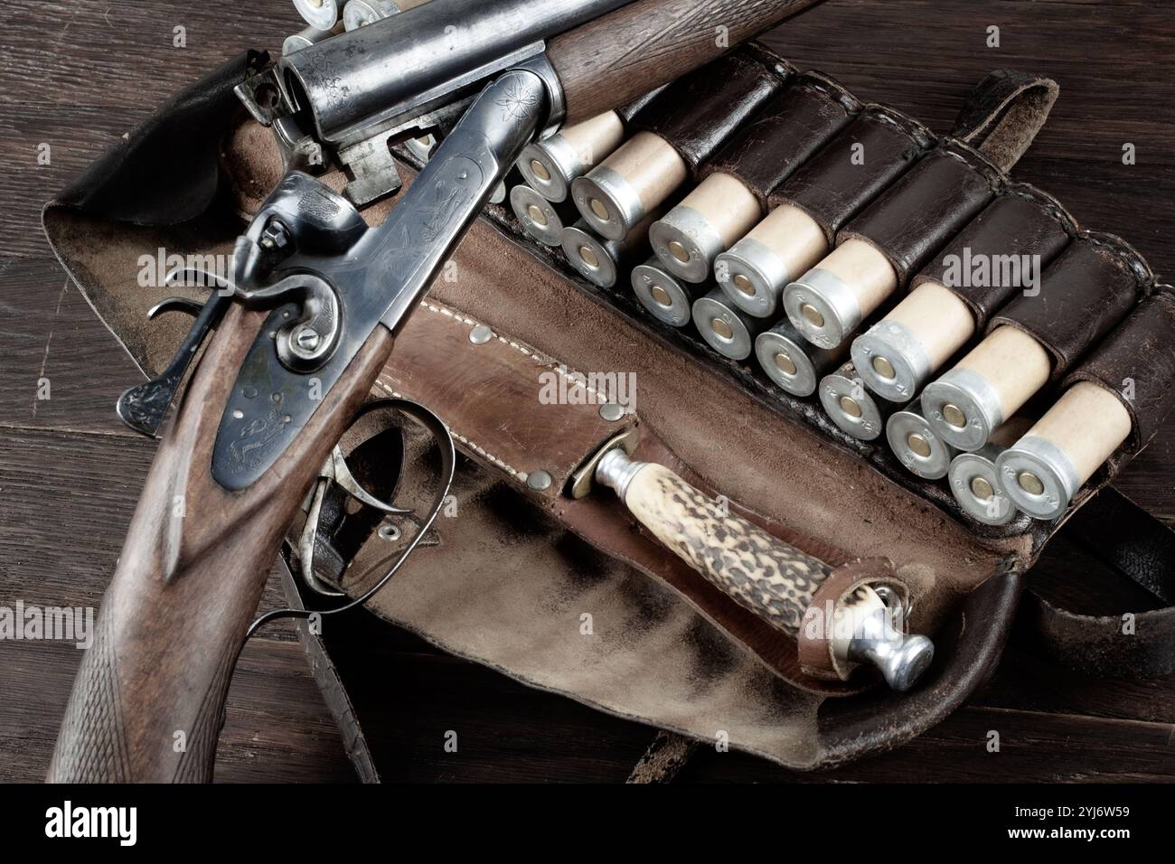 hunting double barreled side shotgun with cartridges in bandolier on ...