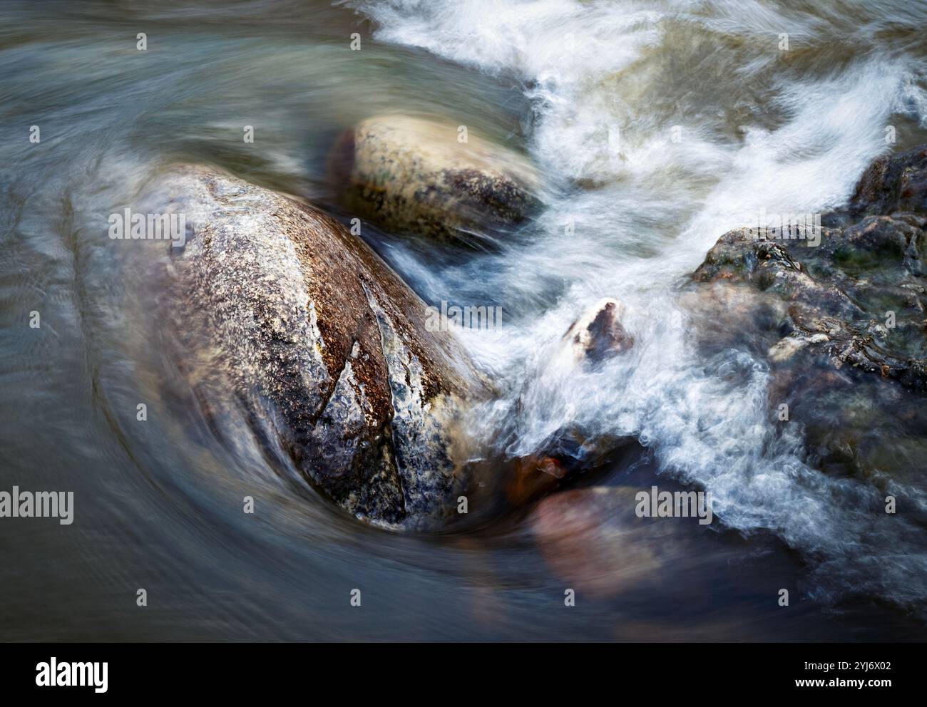 Water flows around stone hi-res stock photography and images - Alamy