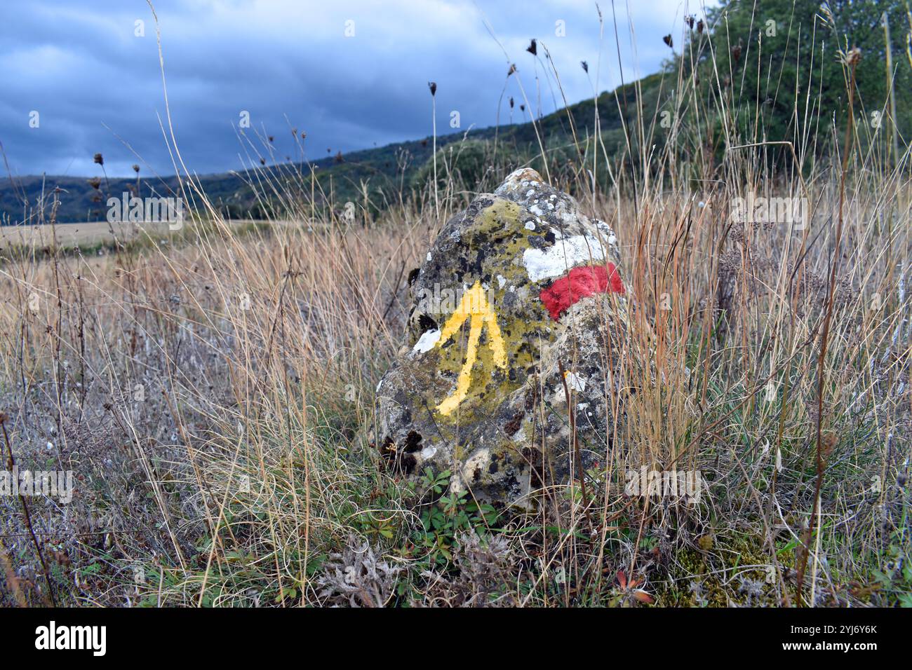 Red and white sign of the GR footpaths and yellow arrow of Camino de ...