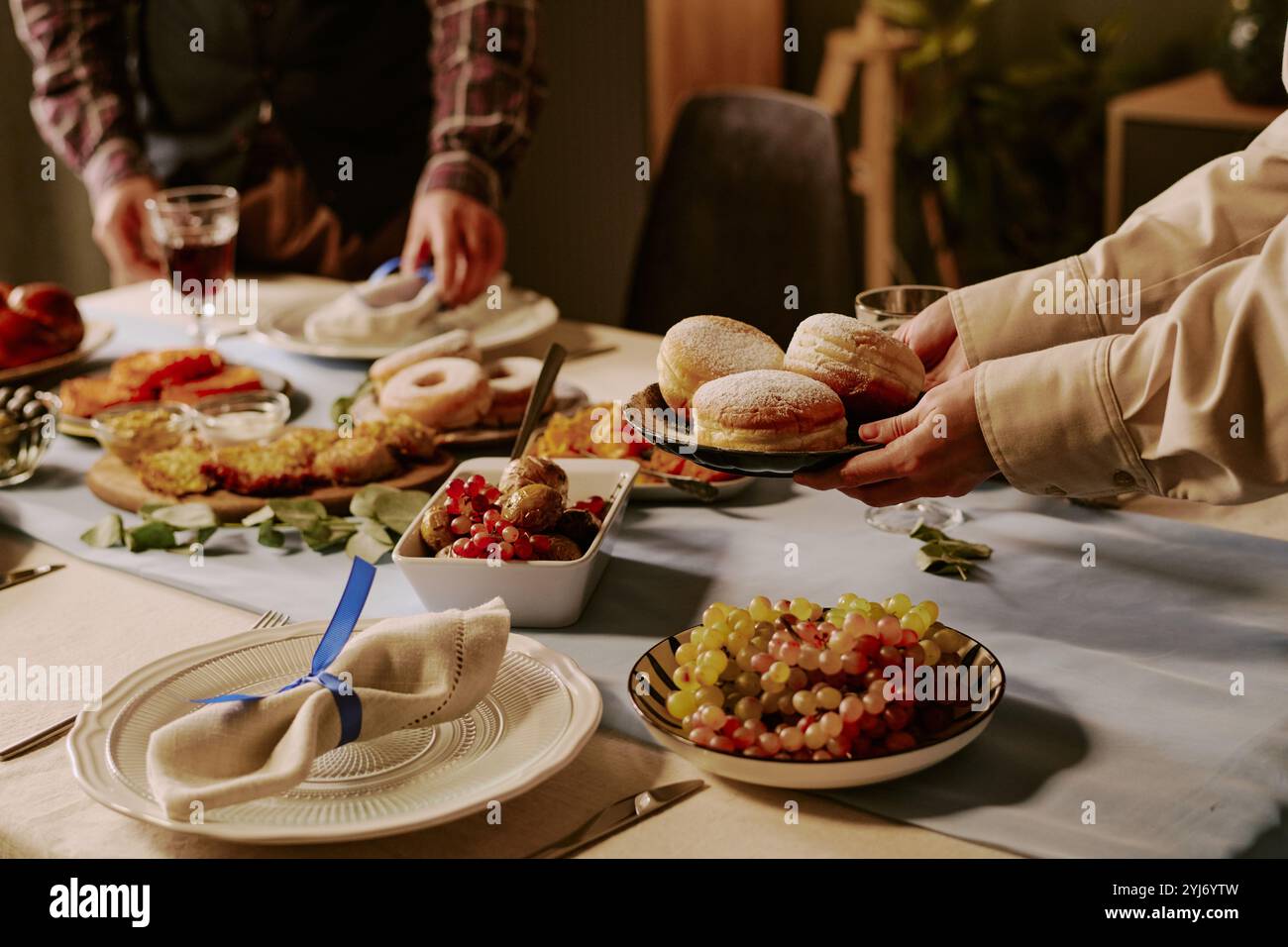 Medium close up of table with appetizers and pastries, unrecognizable ...