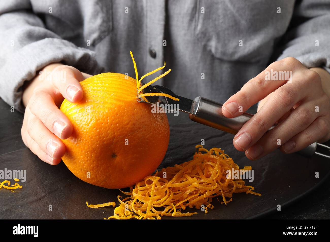 Closeup hands peeling orange fruit hi-res stock photography and images ...