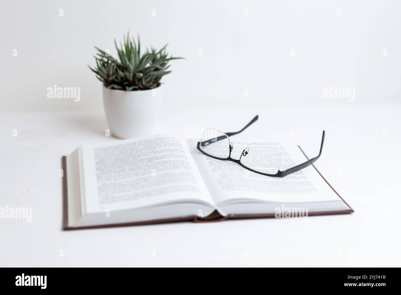Open book with glasses hi-res stock photography and images - Alamy