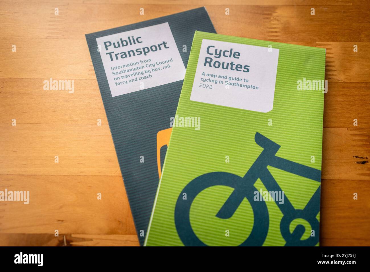 Two guides with maps to public transport and cycle routes in ...
