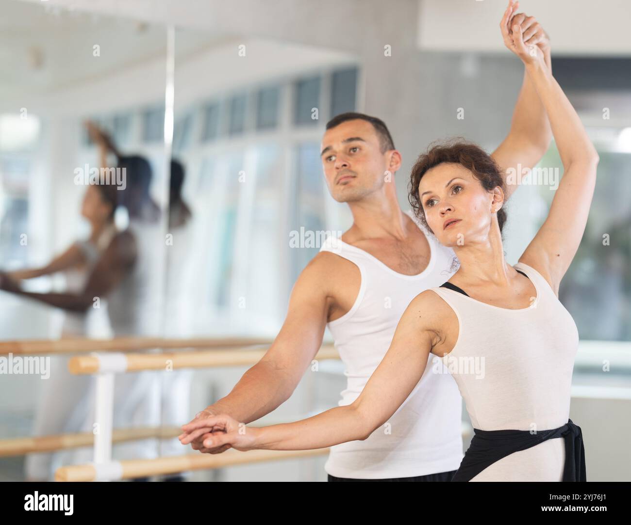Ballet partners mastering paired technique during group class Stock ...