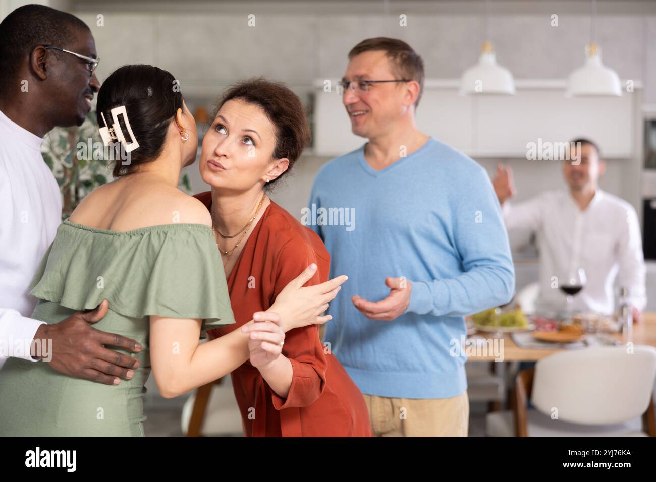 Happy group family friends greet hi-res stock photography and images ...