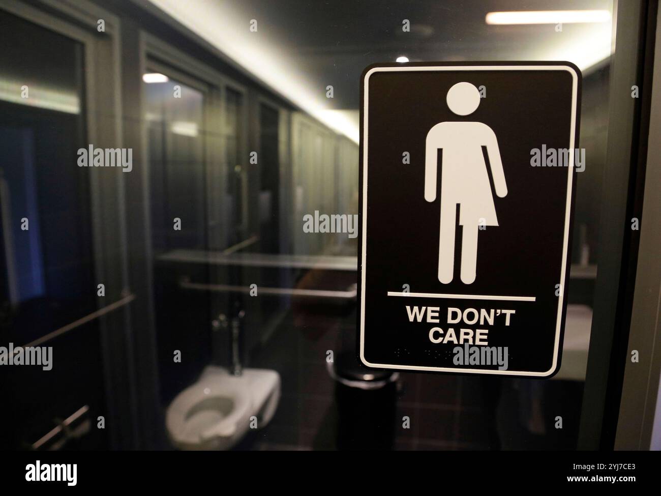 FILE - Signage hangs outside a restroom at 21c Museum Hotel in Durham ...