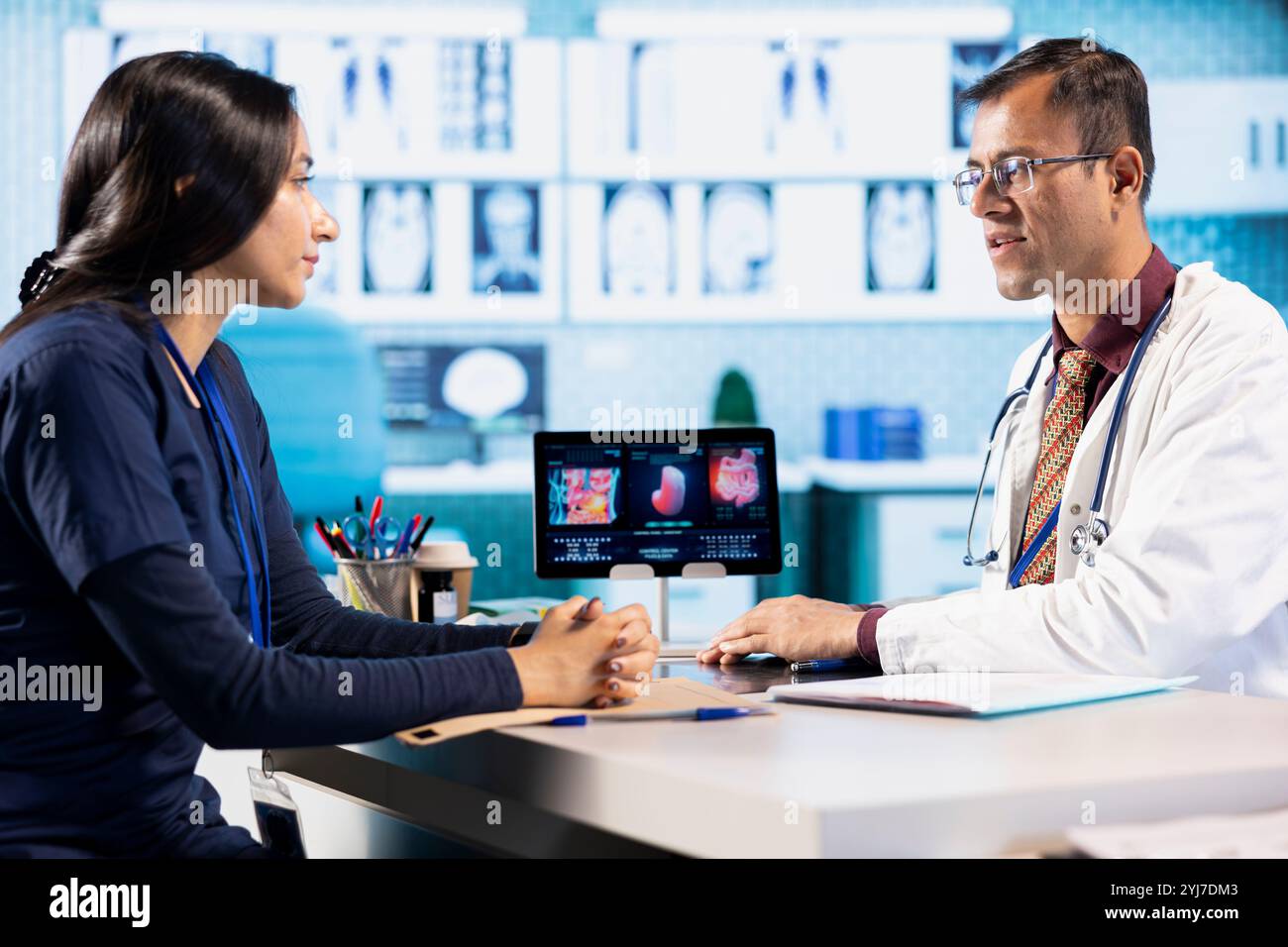 Physician meeting with a patient to discuss medical test results in a ...