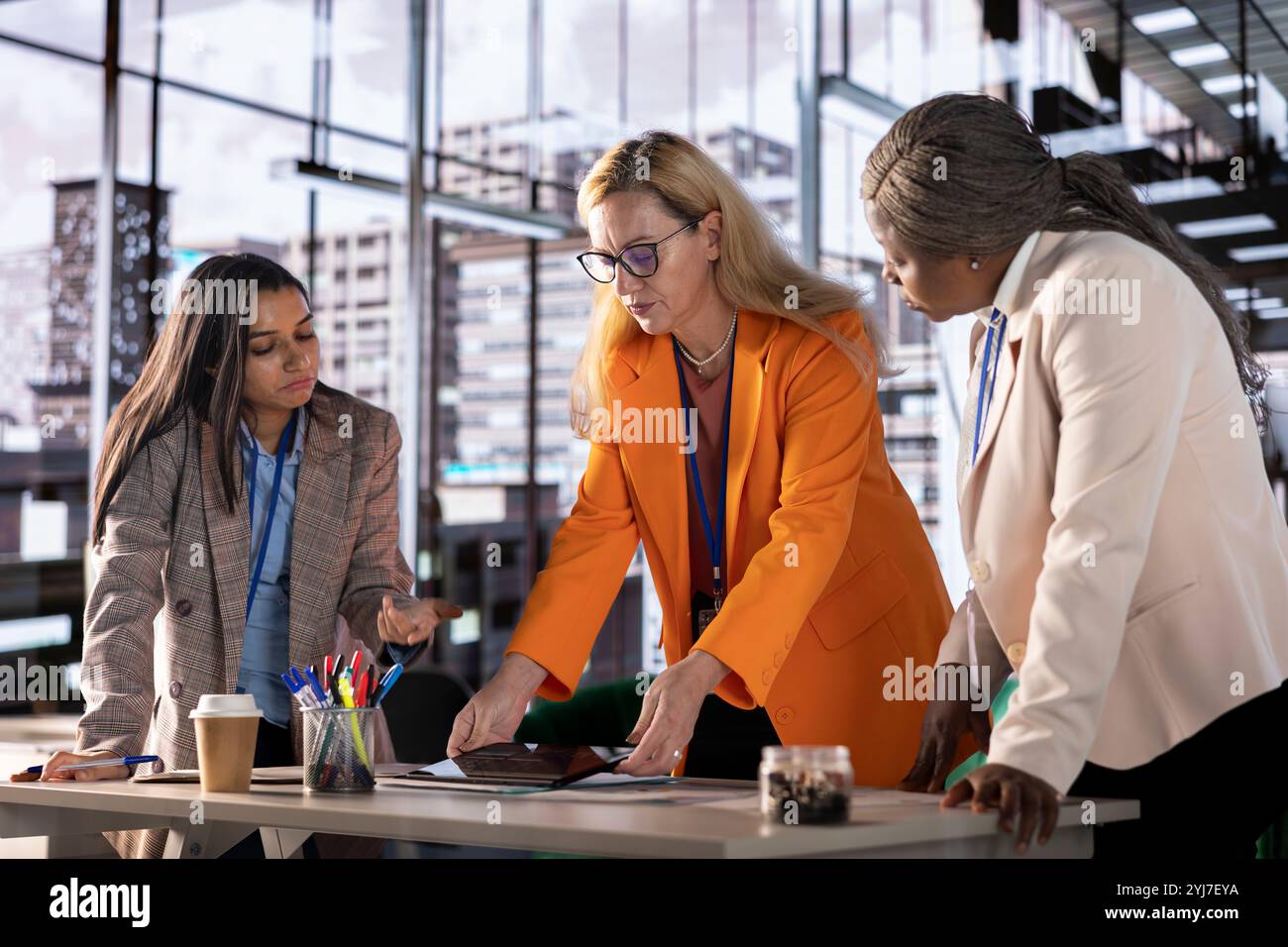 Women leaders strategizing in a corporate office focused on growth ...