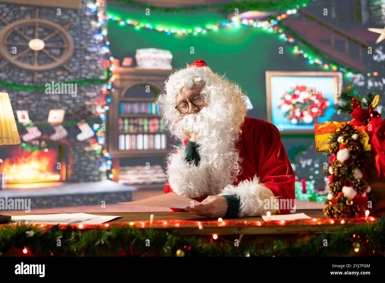 Santa Claus checks his list twice in this warm Christmas setting ...