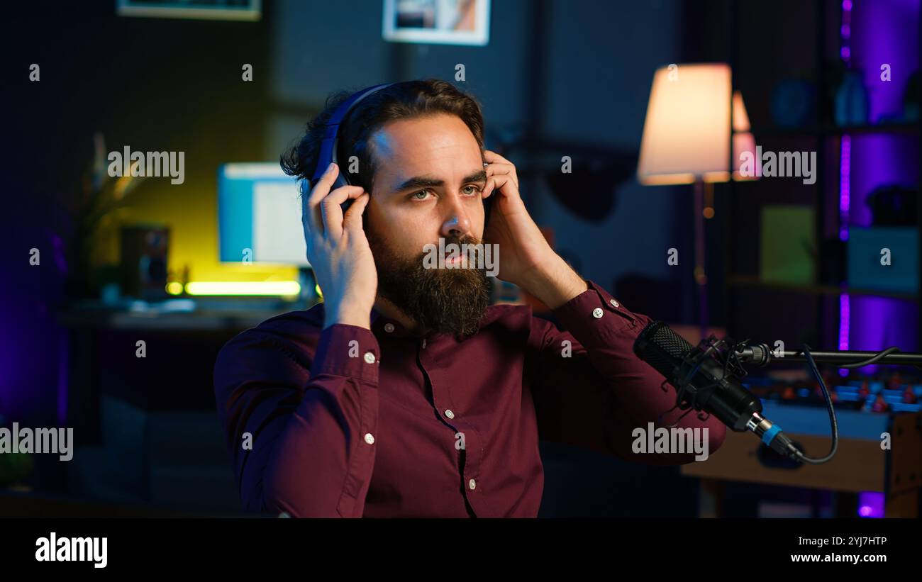 Tech expert testing headphones, review them for online streaming ...