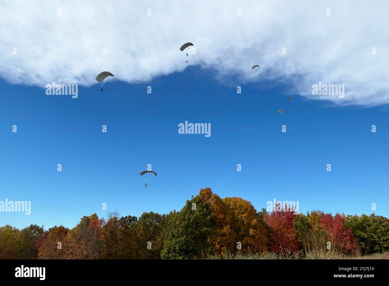 Devens, Massachusetts, USA. 17th Oct, 2024. Army Special Forces conduct a parachute jump onto ...