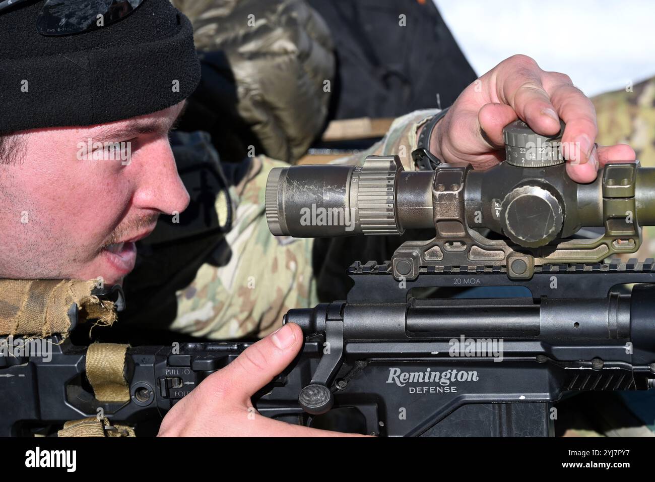 A U.S. Army paratrooper assigned to 173rd Airborne Brigade, adjusts the ...
