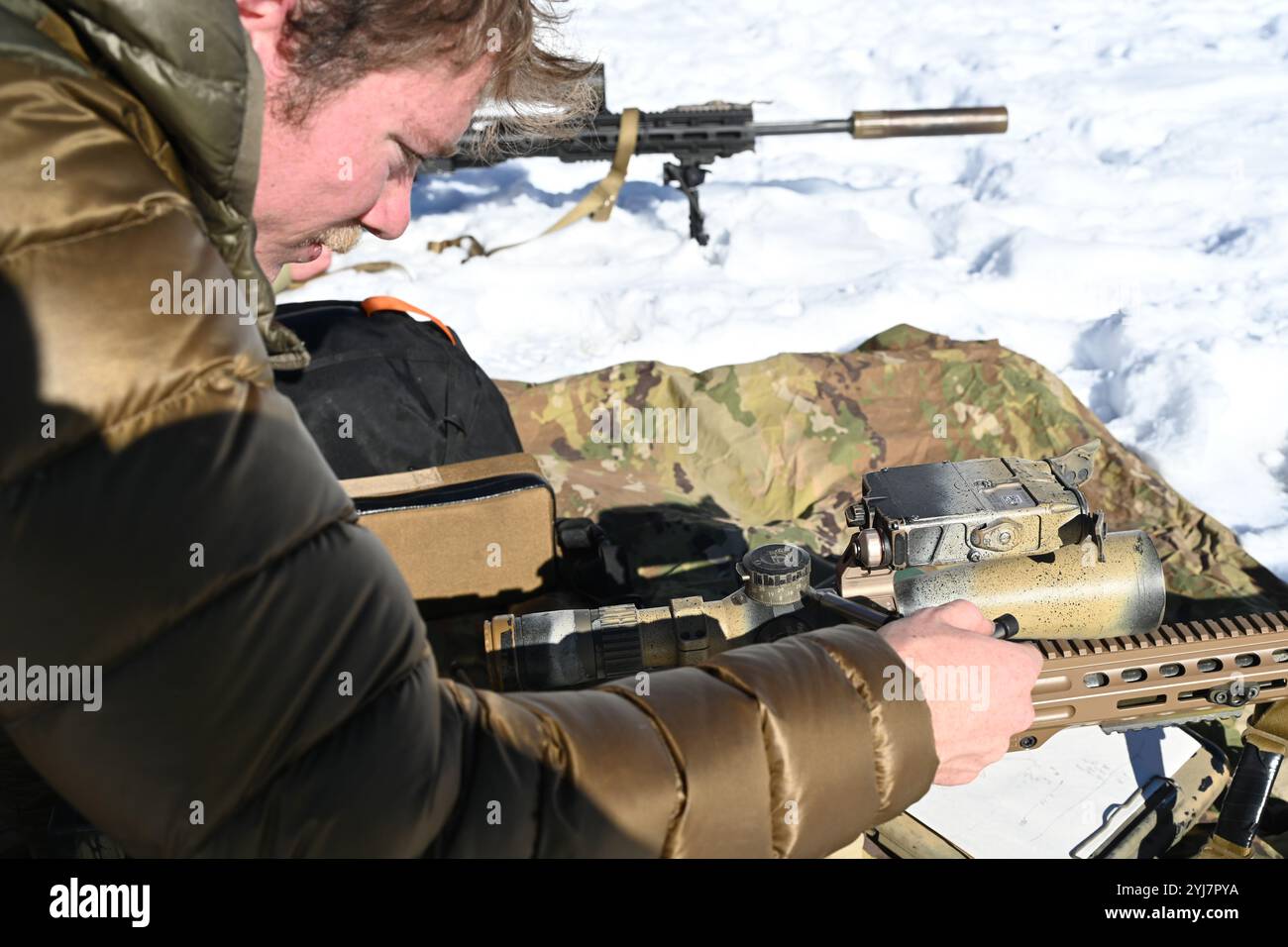 A U.S. Army paratrooper assigned to 173rd Airborne Brigade, adjusts the ...