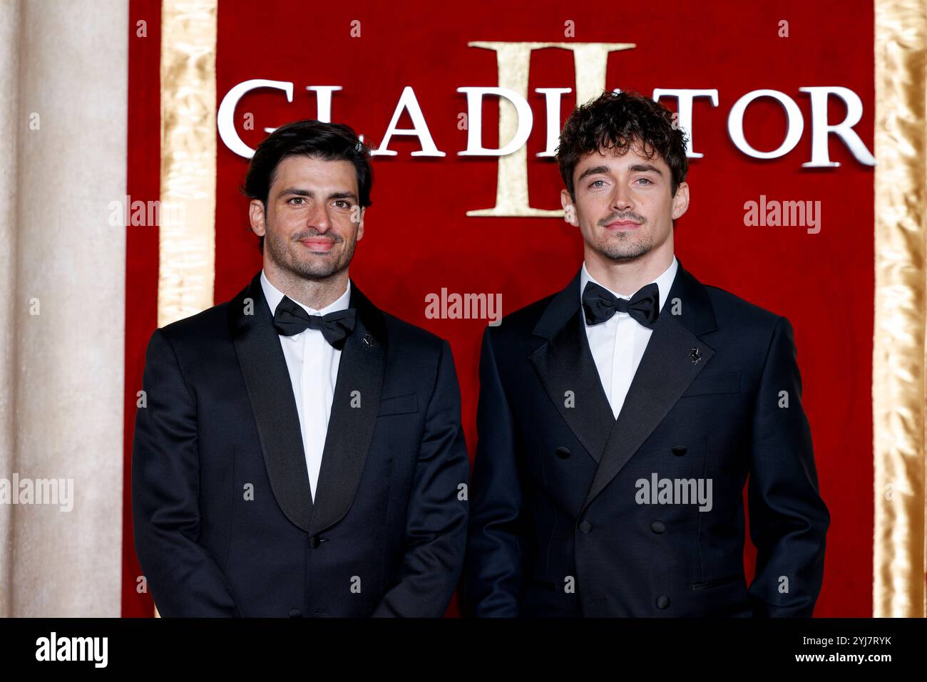 Carlos Sainz Jr., left, and Charles Leclerc pose for photographers upon ...