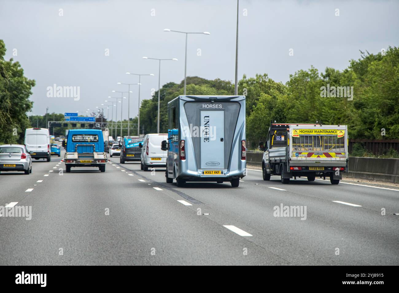 London, UK- June 30, 2023: Traffic on M25 motorway with horse carrier ...