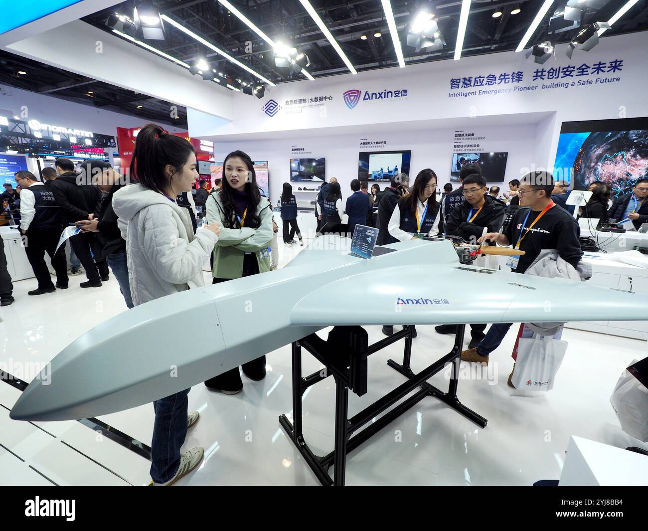 Visitors visit the "Fixed wing Long endurance Communication Support Patrol Equipment" at the ...