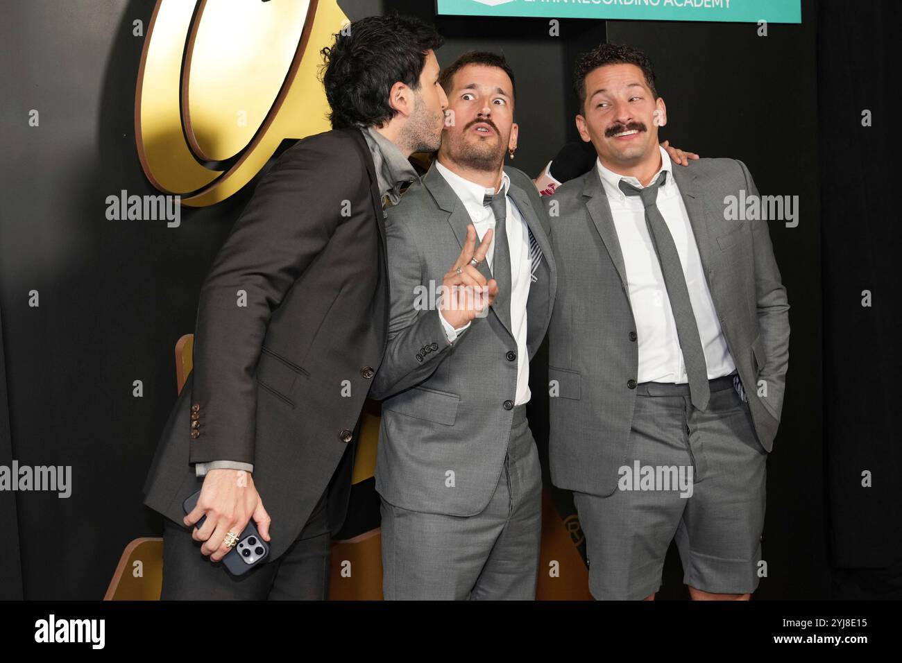 Sebastian Yatra, left, Mau and Ricky arrive at the Latin Grammys Person ...