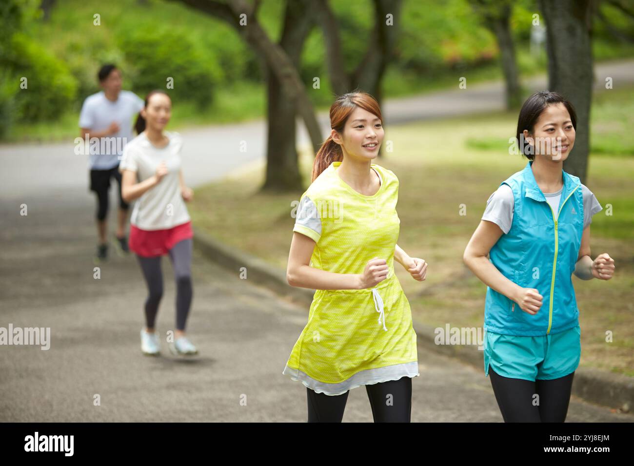 Young man and woman running Stock Photo - Alamy