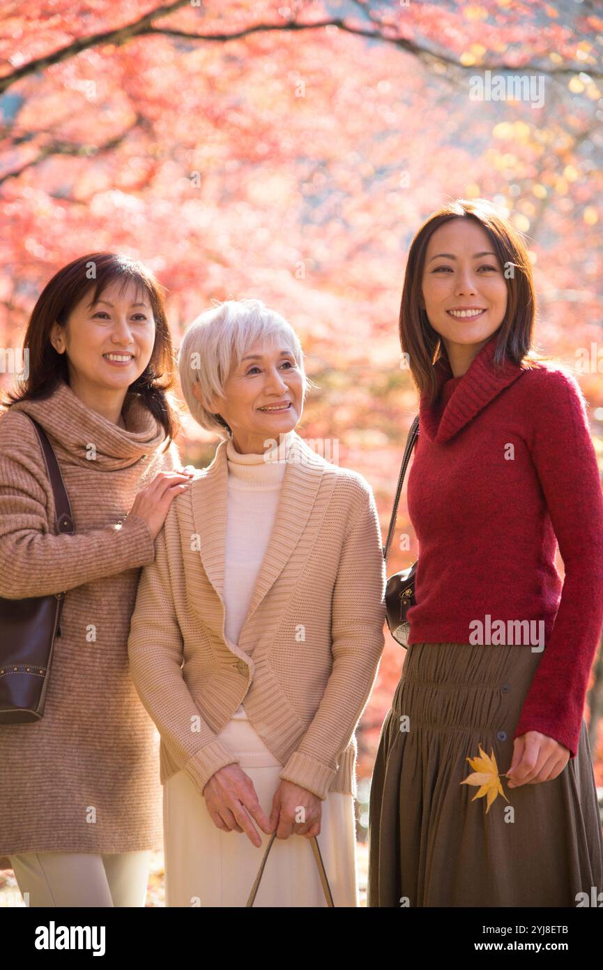 Three generations of women enjoying autumn leaf peeping Stock Photo - Alamy