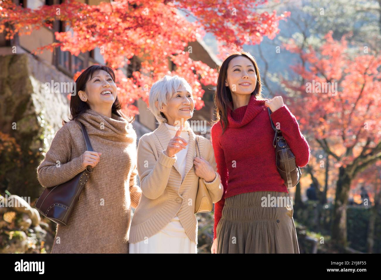Three generations of women enjoying autumn leaf peeping Stock Photo - Alamy