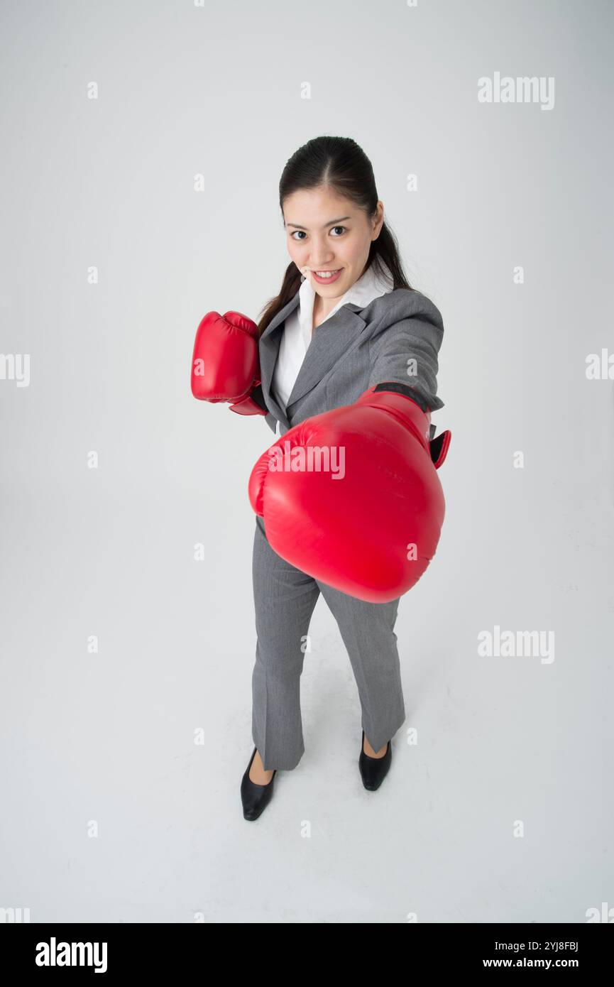 Female office worker boxing Stock Photo - Alamy