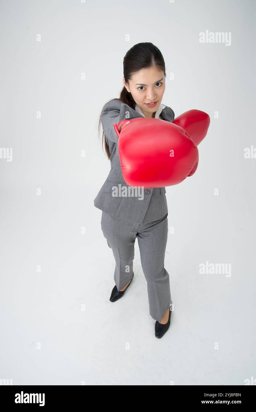 Female office worker boxing Stock Photo - Alamy