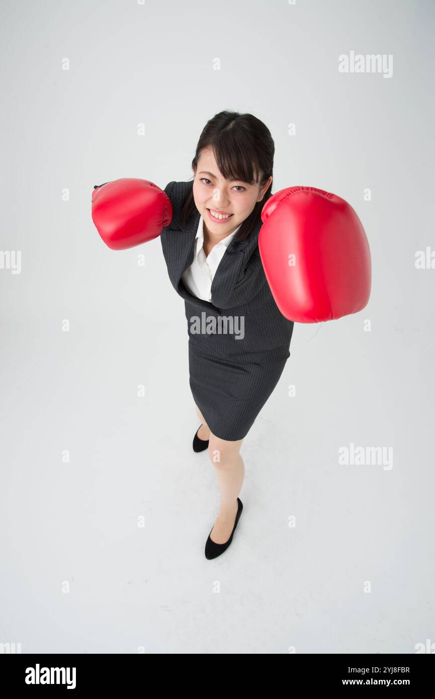 Female office worker boxing Stock Photo - Alamy