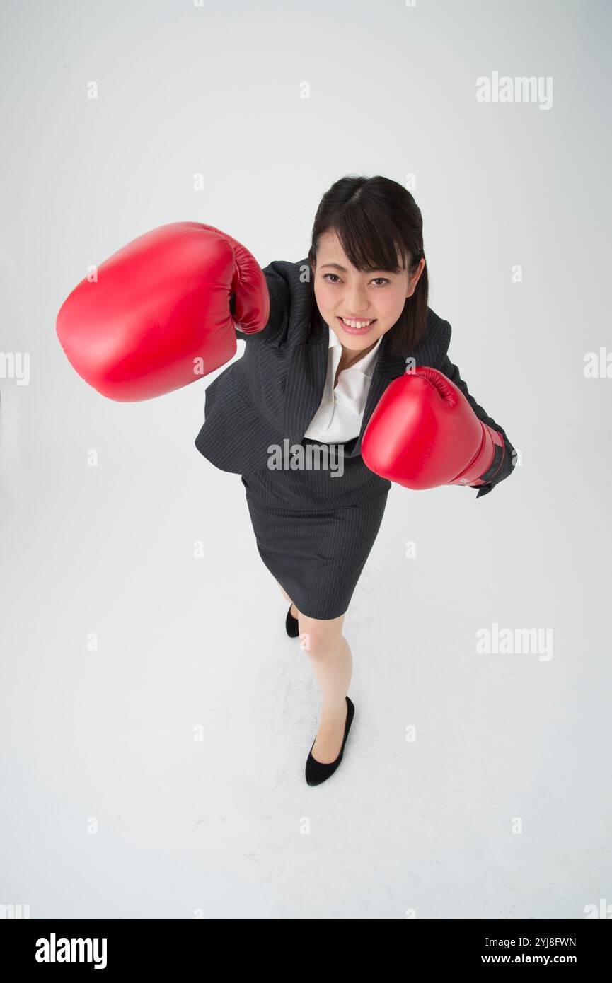 Female office worker boxing Stock Photo - Alamy