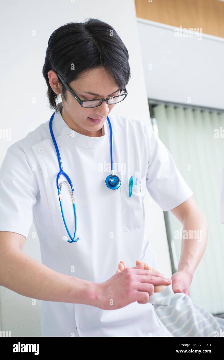Doctor and patient in bed hi-res stock photography and images - Alamy