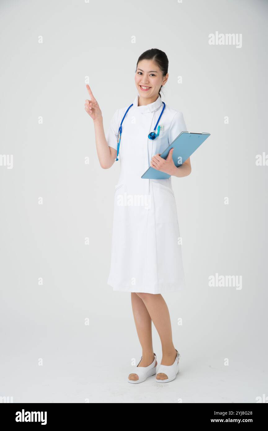 Nurse pointing pointing Stock Photo - Alamy