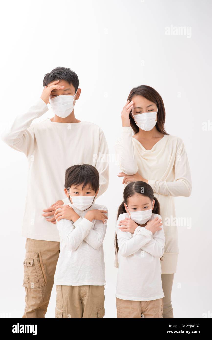 Family members with symptoms of illness wearing masks Stock Photo - Alamy