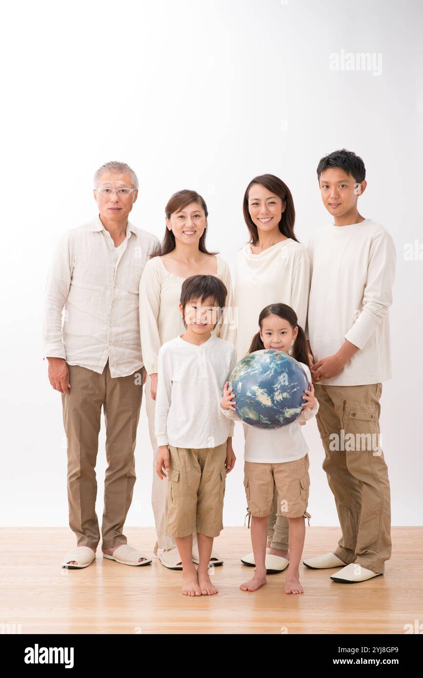 Three-generation family and the earth Stock Photo - Alamy