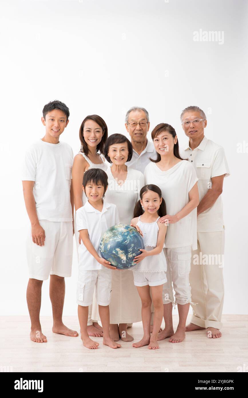 Family of four and the earth Stock Photo - Alamy