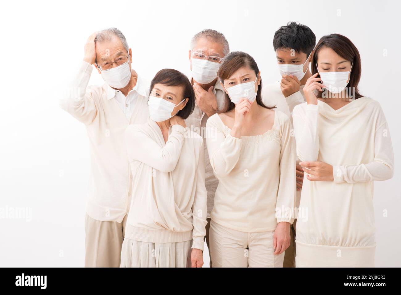 Three-generation family with masked illness symptoms Stock Photo - Alamy