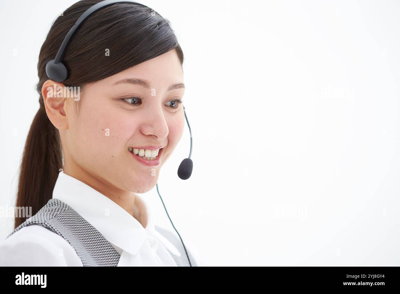 Operator woman with intercom Stock Photo - Alamy