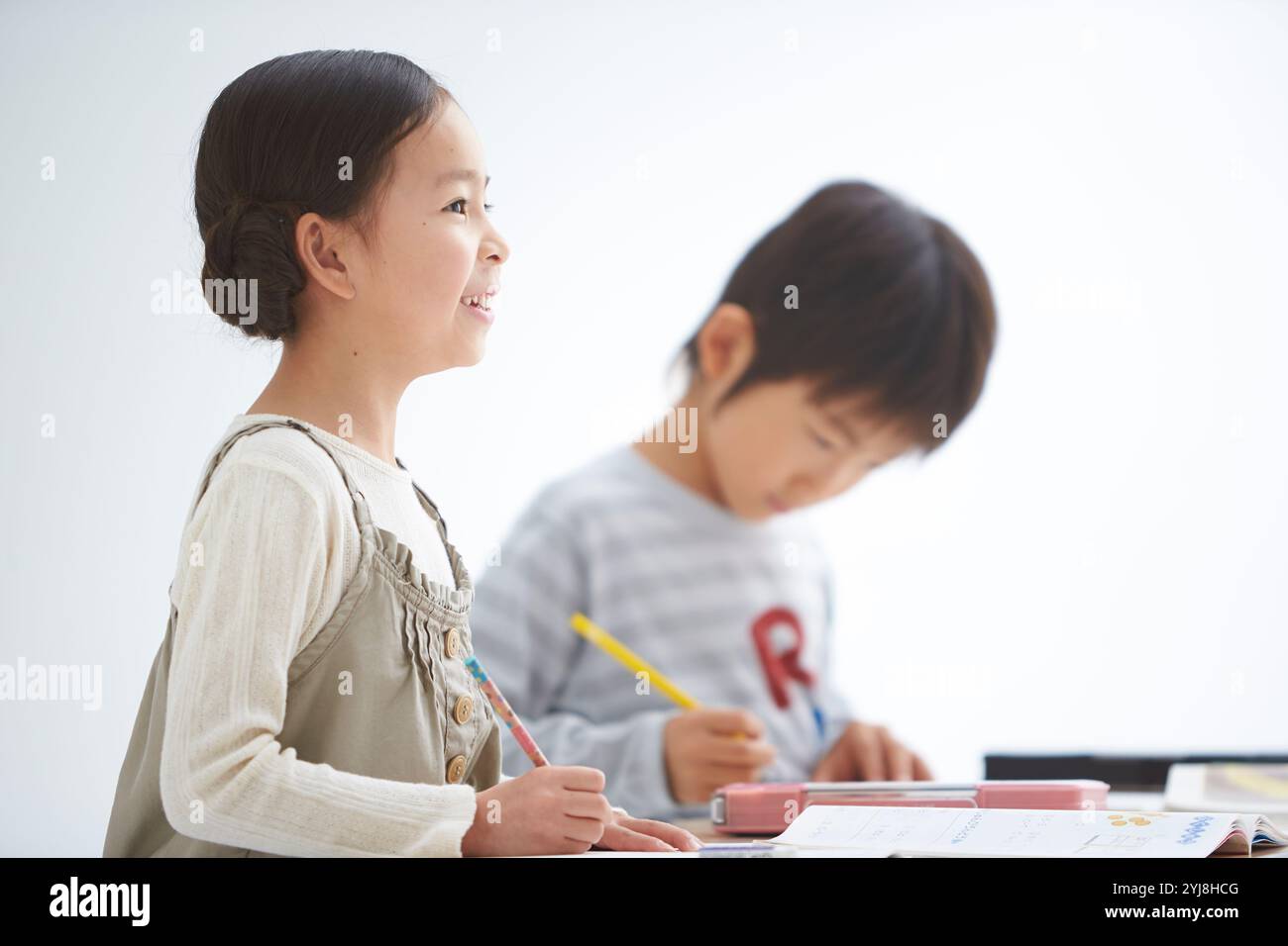 Male and female lower primary school pupils in class Stock Photo - Alamy