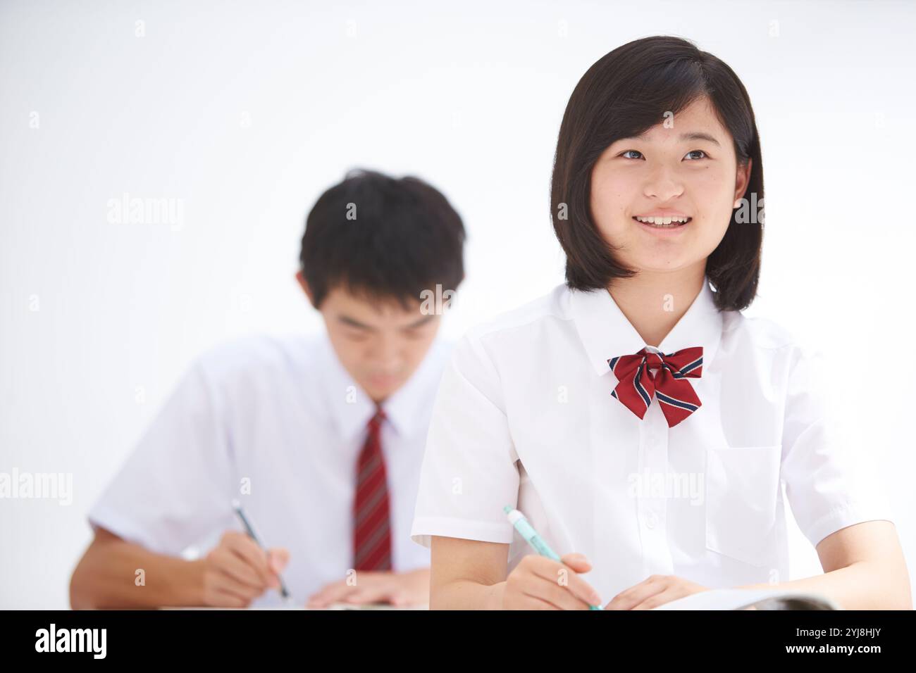 Male and female high school students in class Stock Photo - Alamy