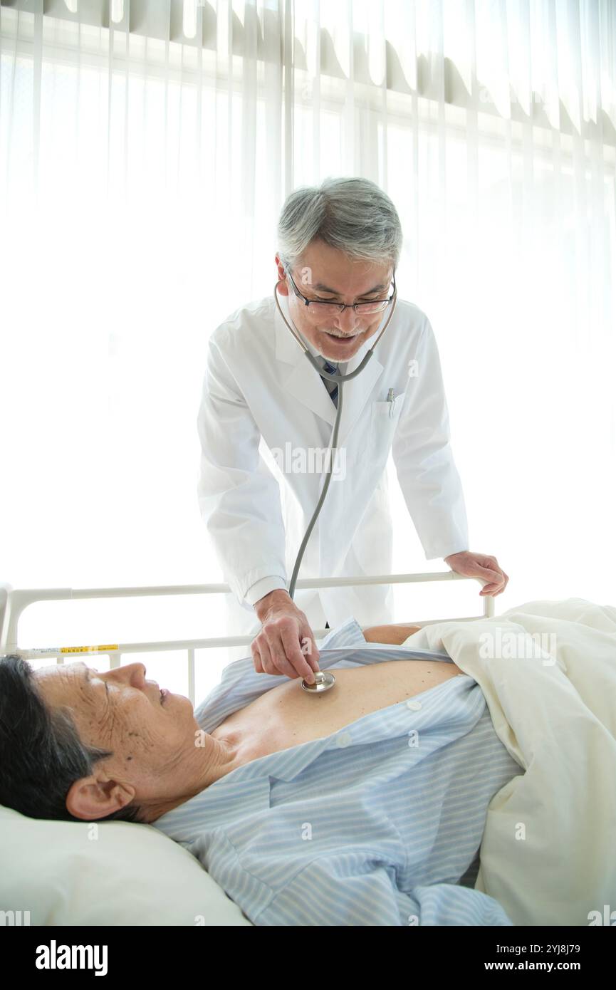 Old man doctor in white hi-res stock photography and images - Alamy