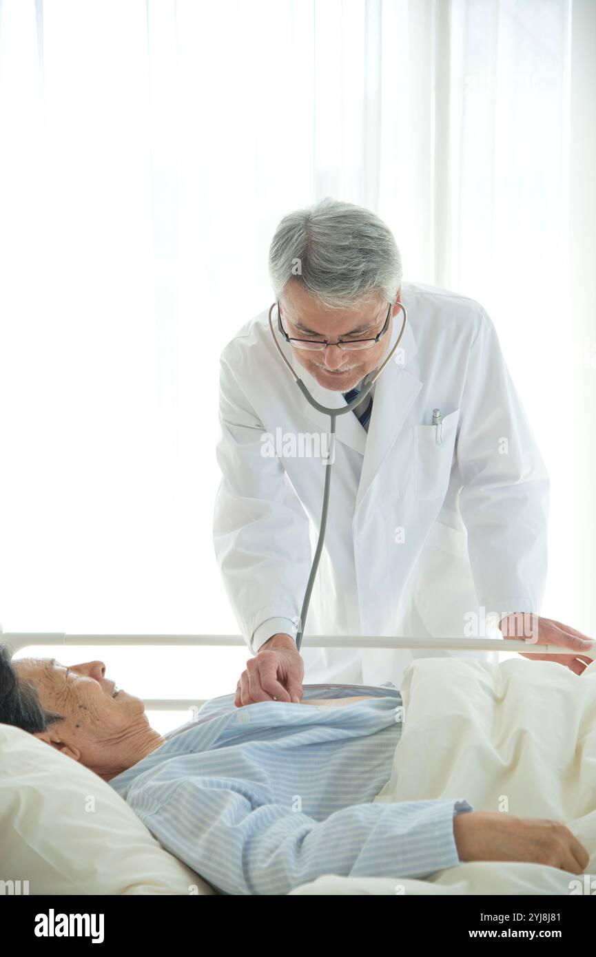 Old man doctor in white hi-res stock photography and images - Alamy